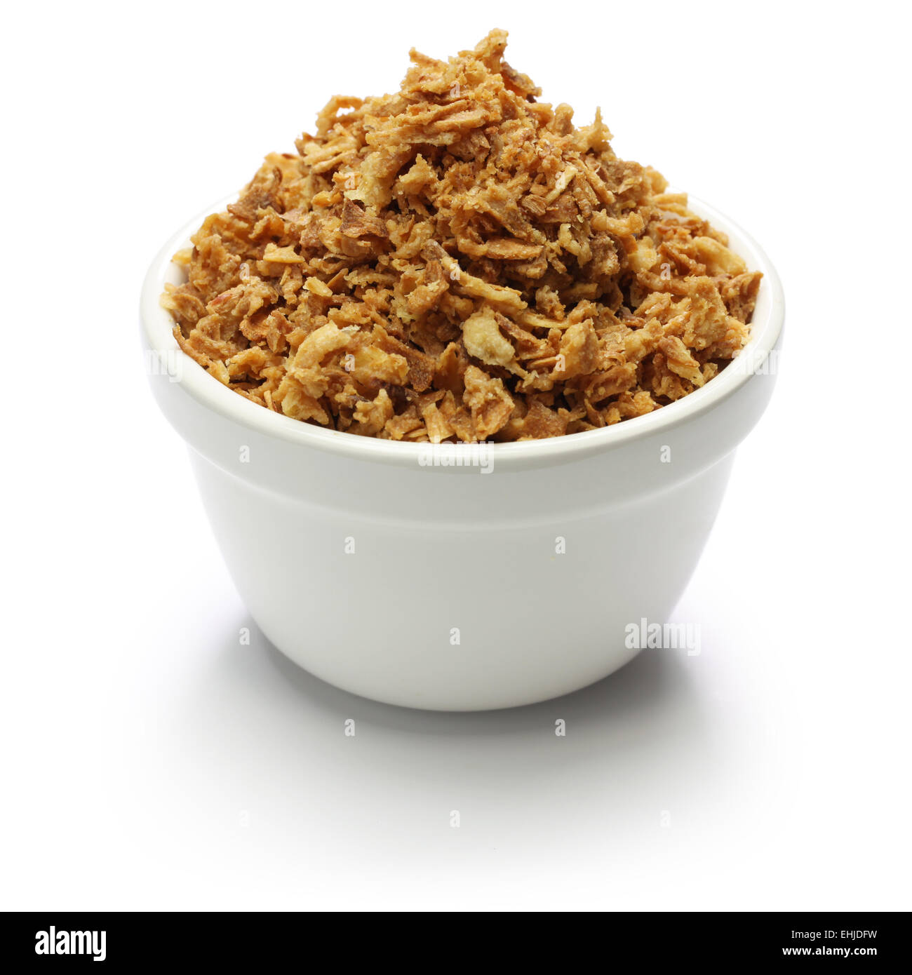 crispy fried onion flakes on white background Stock Photo - Alamy