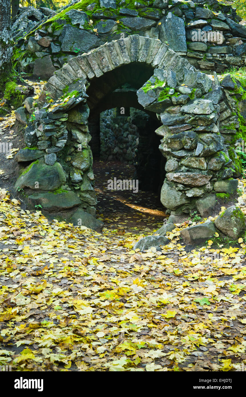 Input in a stone cave Stock Photo - Alamy