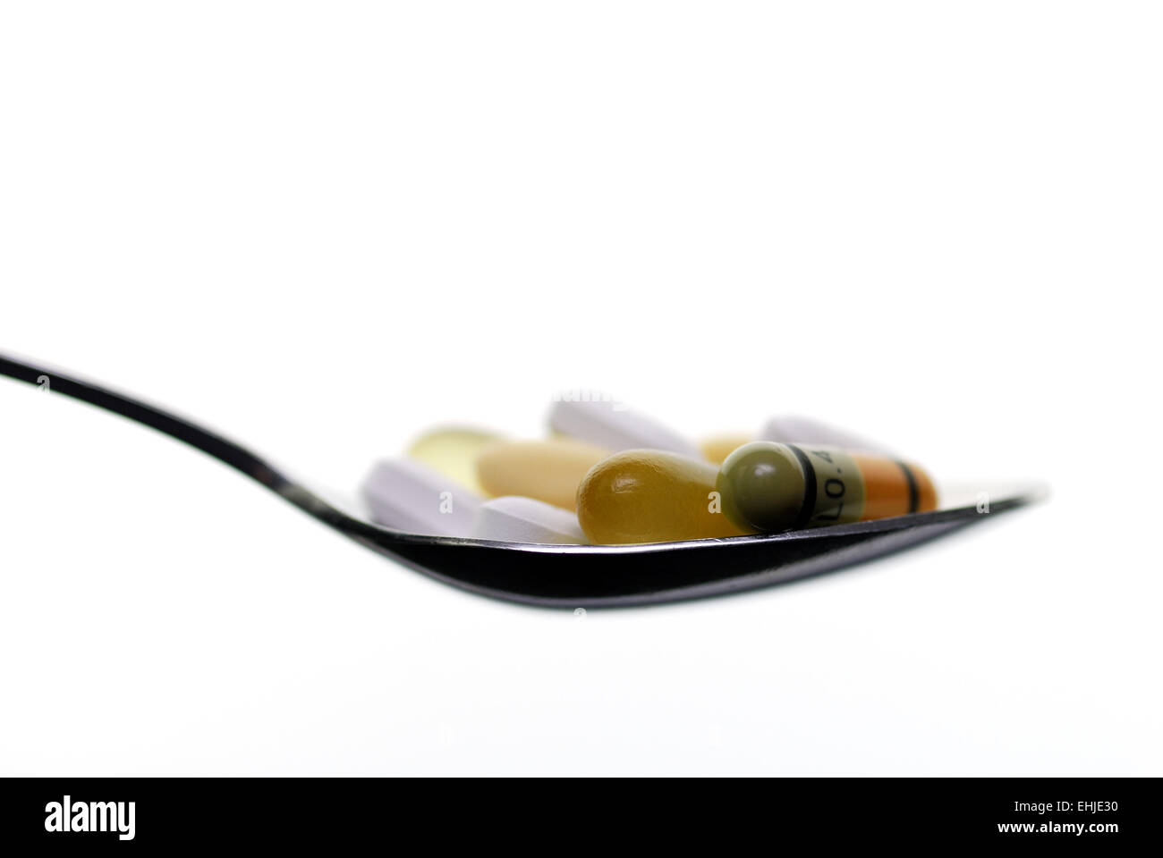Pills spoon hi-res stock photography and images - Alamy