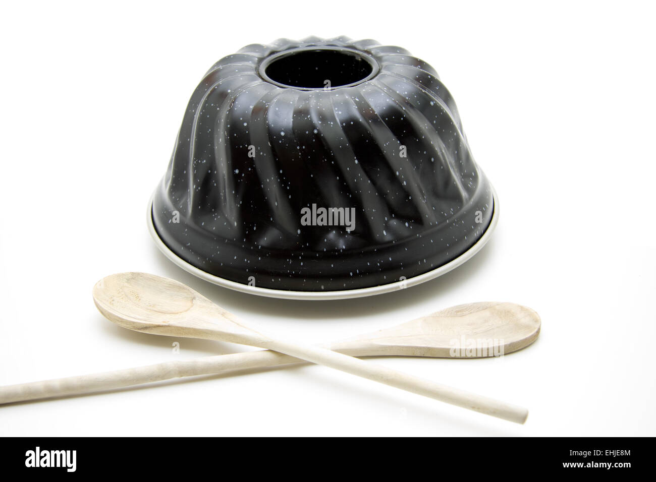 Ring cakes form with wooden spoon Stock Photo - Alamy