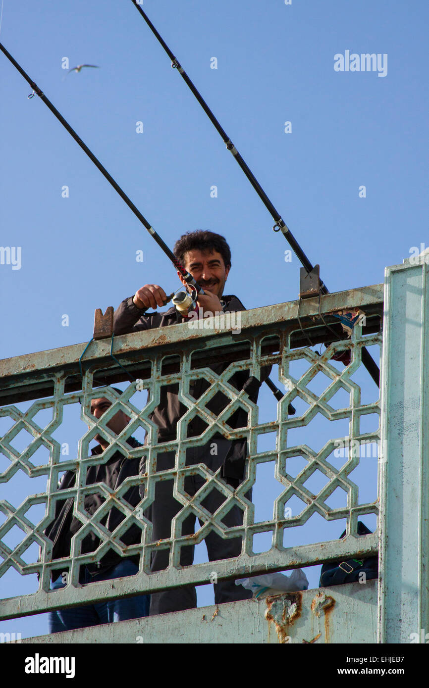 A fisherman on Galata Bridge Stock Photo - Alamy