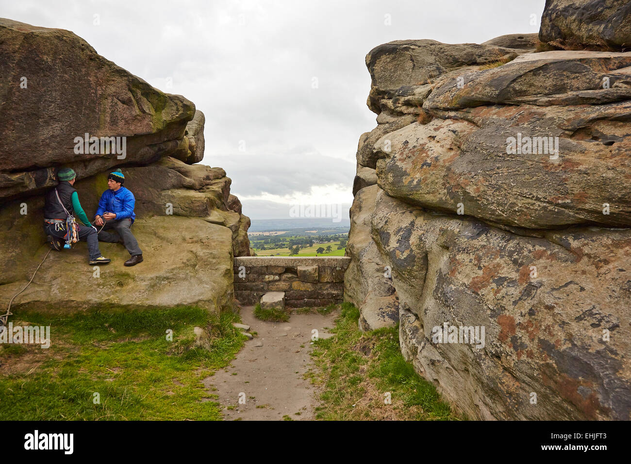 climber giving climbing instructions on Almscliffe Crag Stock Photo - Alamy