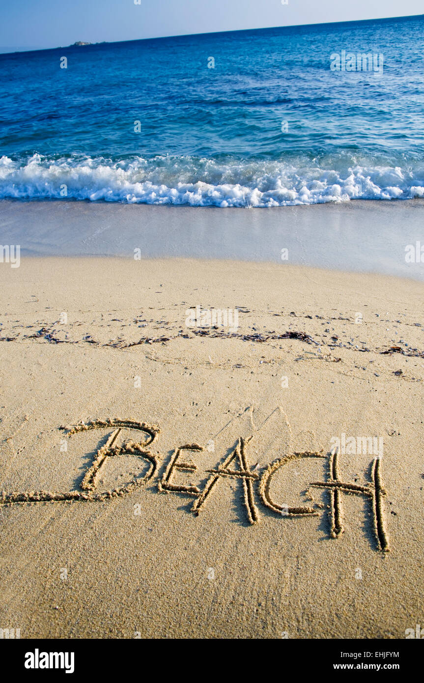 Beach written in Sand Stock Photo - Alamy