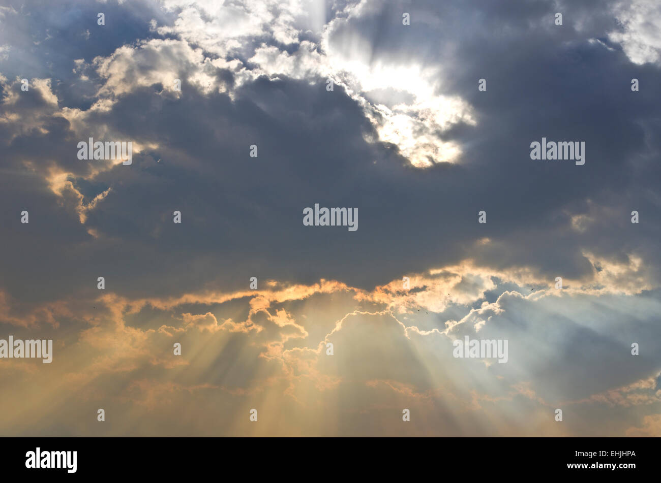 Sun rays shooting out from behind clouds, no people, New Mexico, United ...