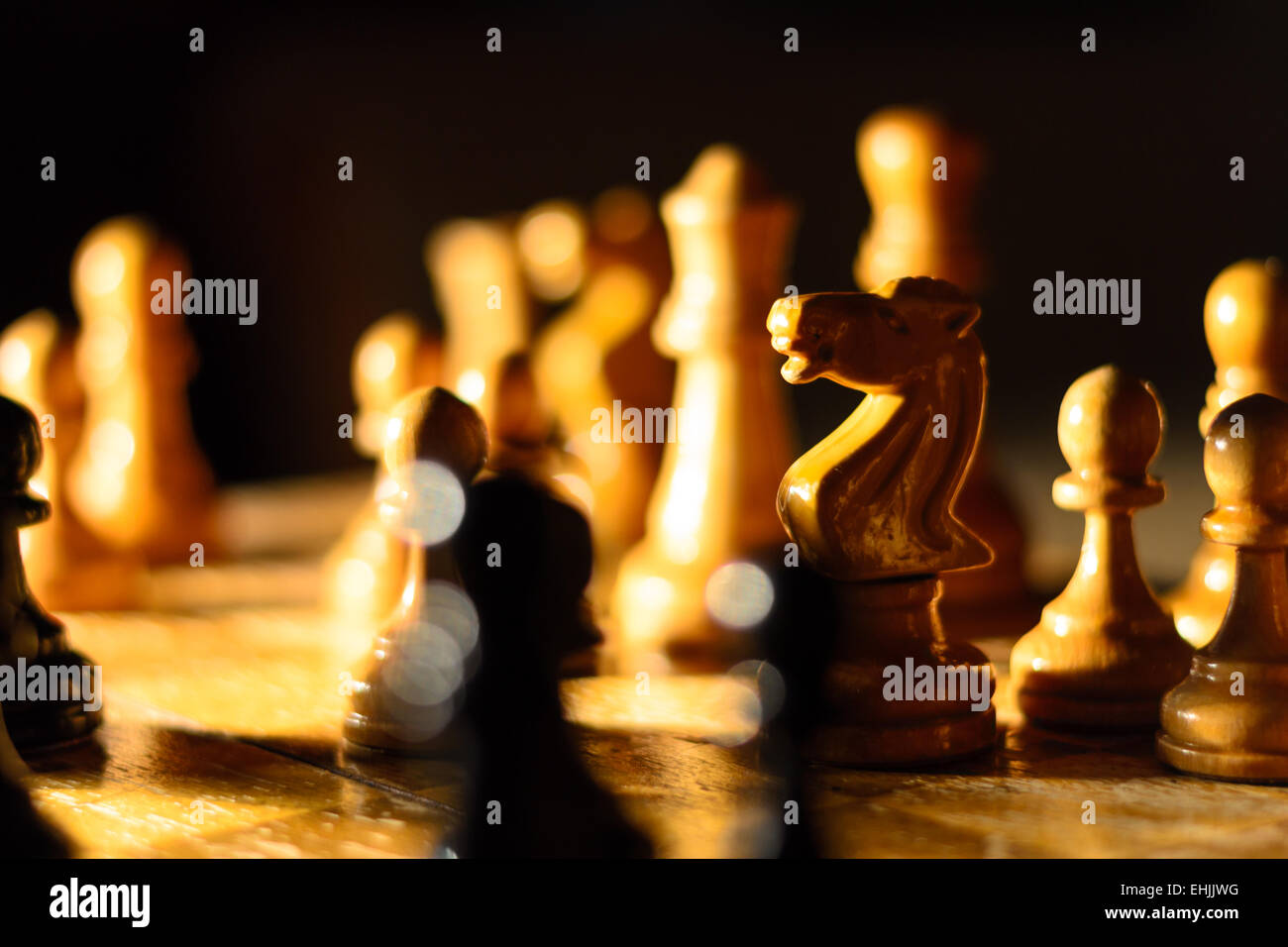 Chess on dark background Stock Photo - Alamy