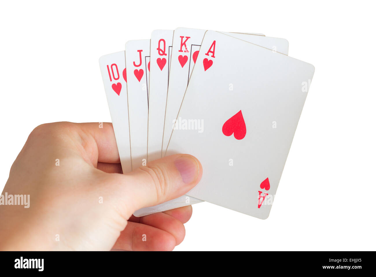 Man's hand holding five playing cards (straight/royal flush of hearts ...