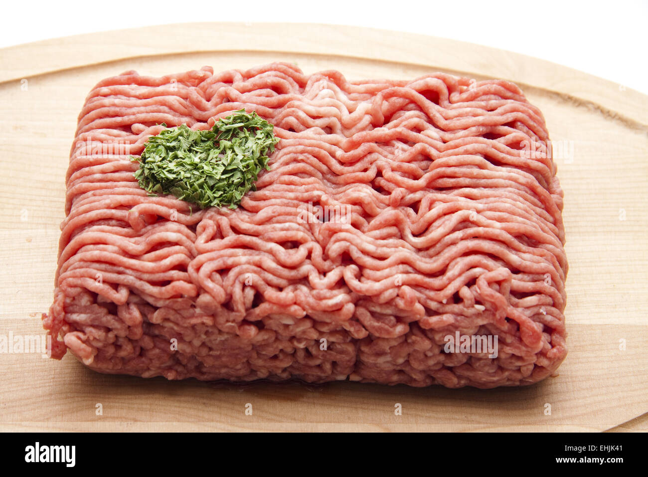 Ground meat raw with herbs Stock Photo - Alamy