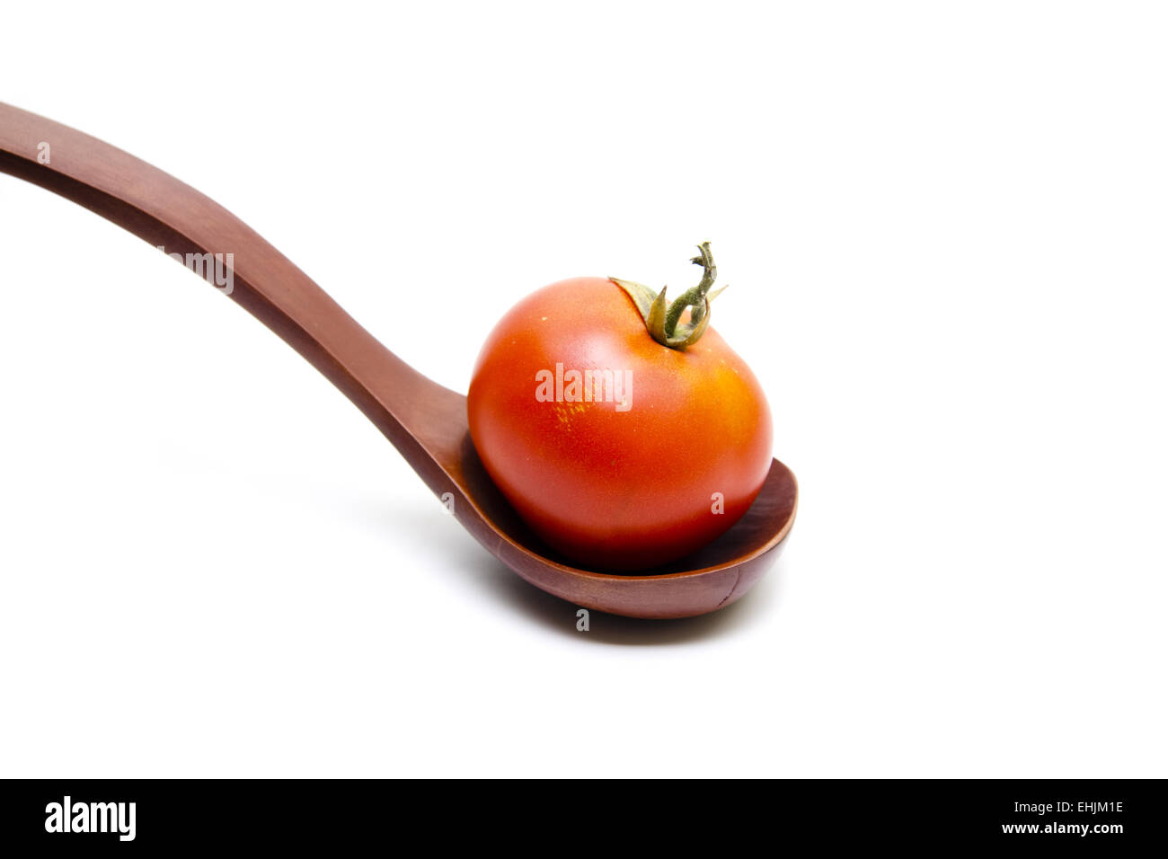 Spoon with tomato Cut Out Stock Images & Pictures - Alamy