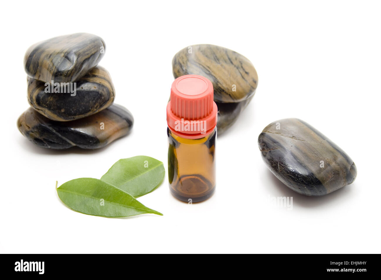 Stones with smell oil and plant leaf Stock Photo - Alamy