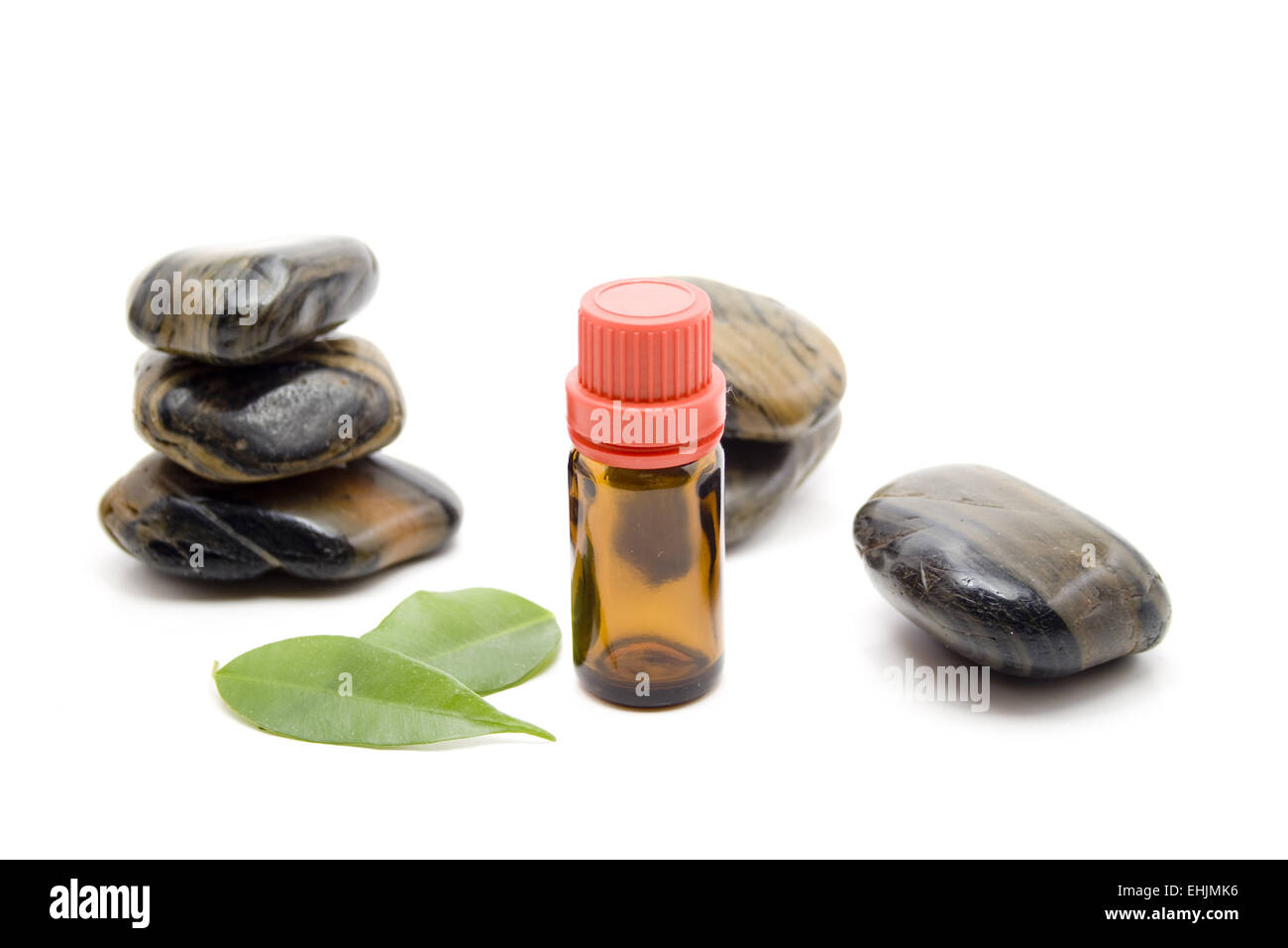 Stones with smell oil and plant leaf Stock Photo - Alamy