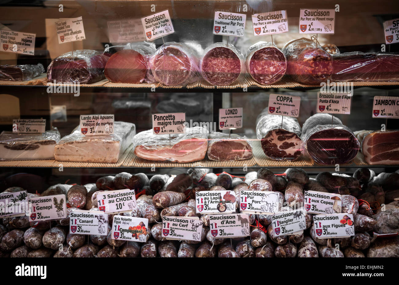 NICE, FRANCE - OCTOBER 2, 2014: Cured meats on display in butcher shop ...