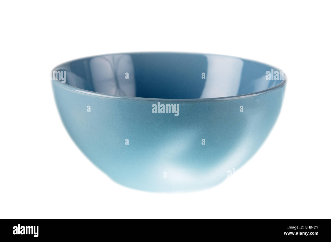 Blue ceramic bowl, isolated on white Stock Photo - Alamy