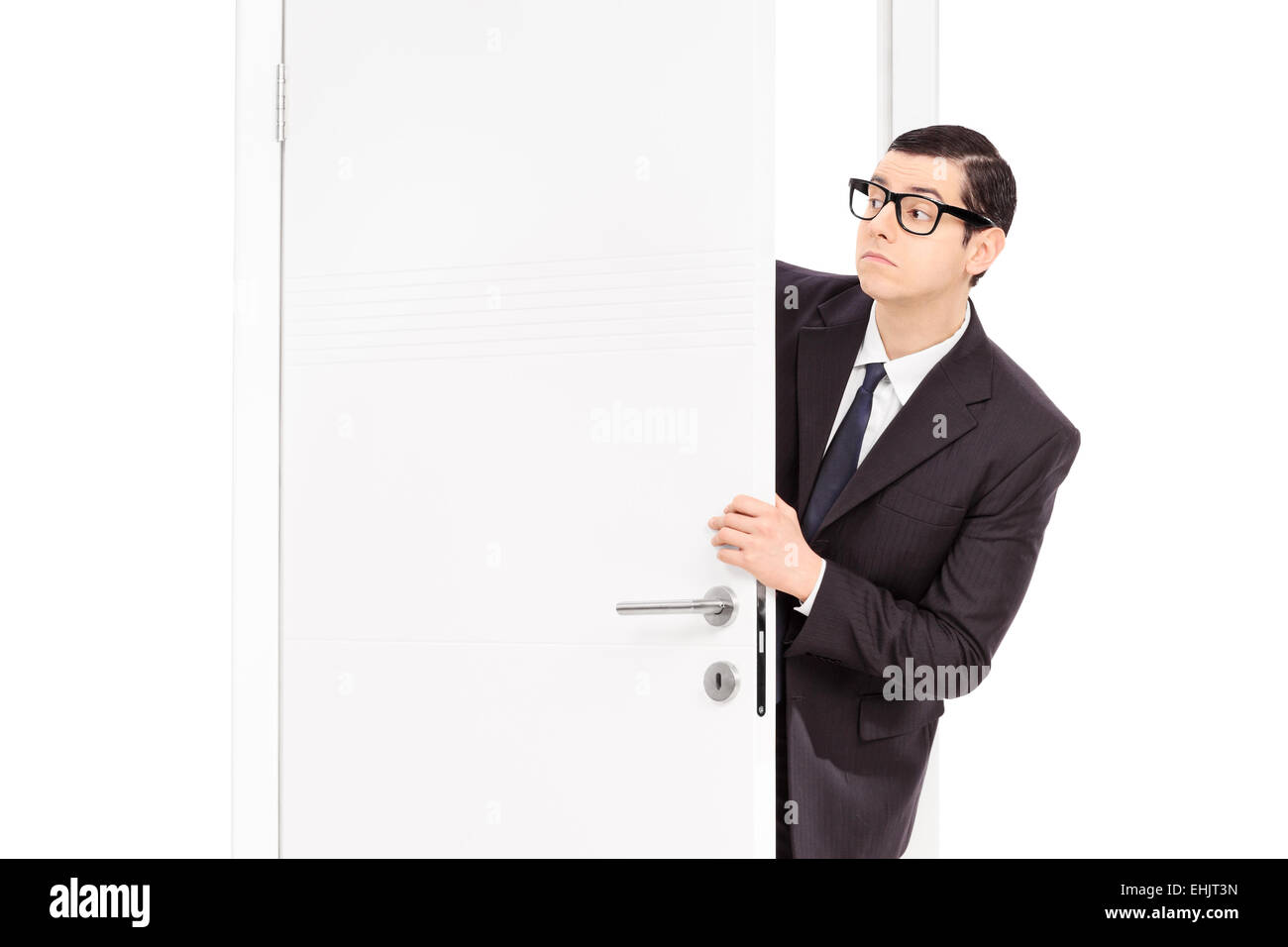 Man peeking door hi-res stock photography and images - Alamy