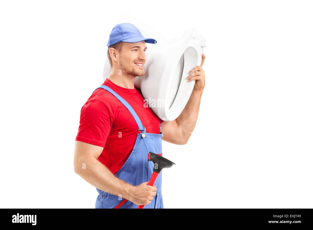 Male plumber carrying a toilet and holding a plunger isolated on white ...