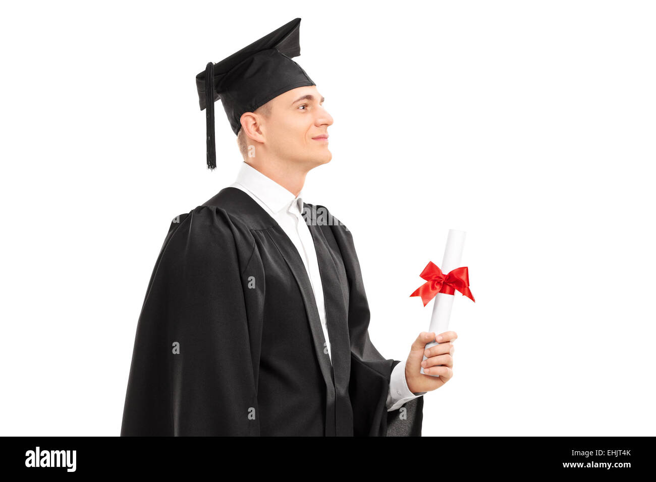 Proud college graduate holding a diploma isolated on white background ...