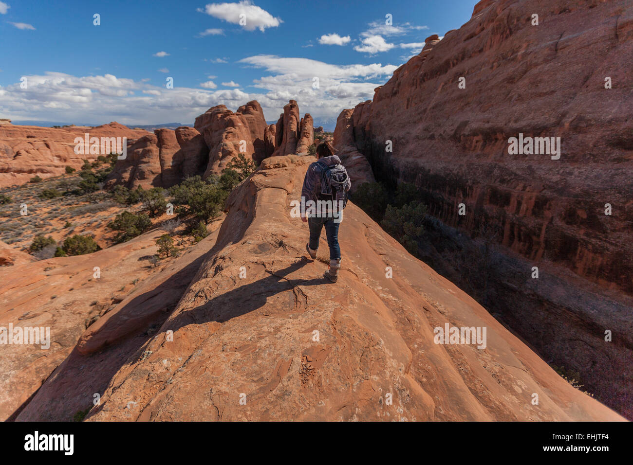 Female adventurer exploring the desert Stock Photo - Alamy