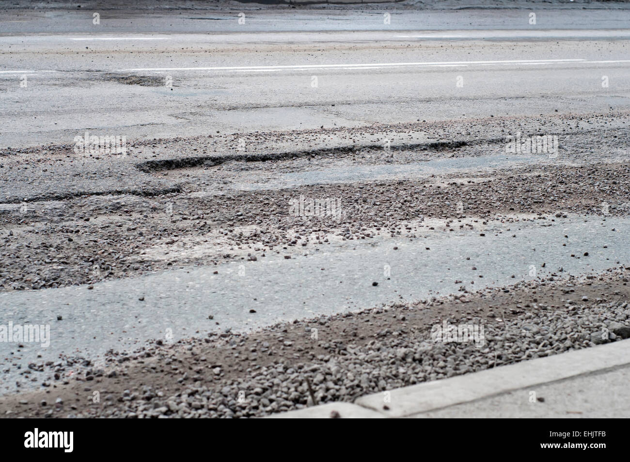 Large deep pothole of poor road maintenance due to cutbacks on the ...