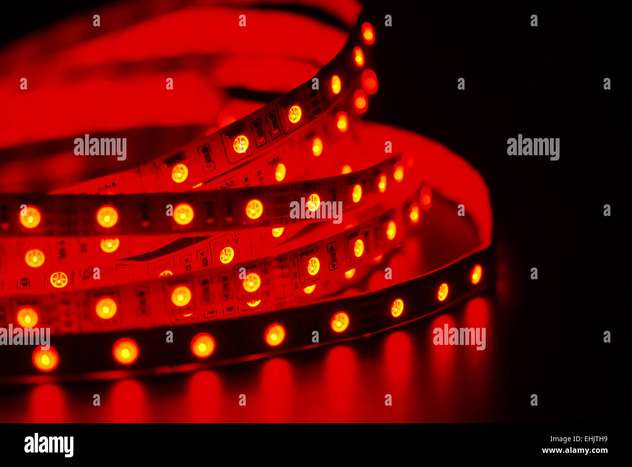 red led stripe on the black background Stock Photo - Alamy