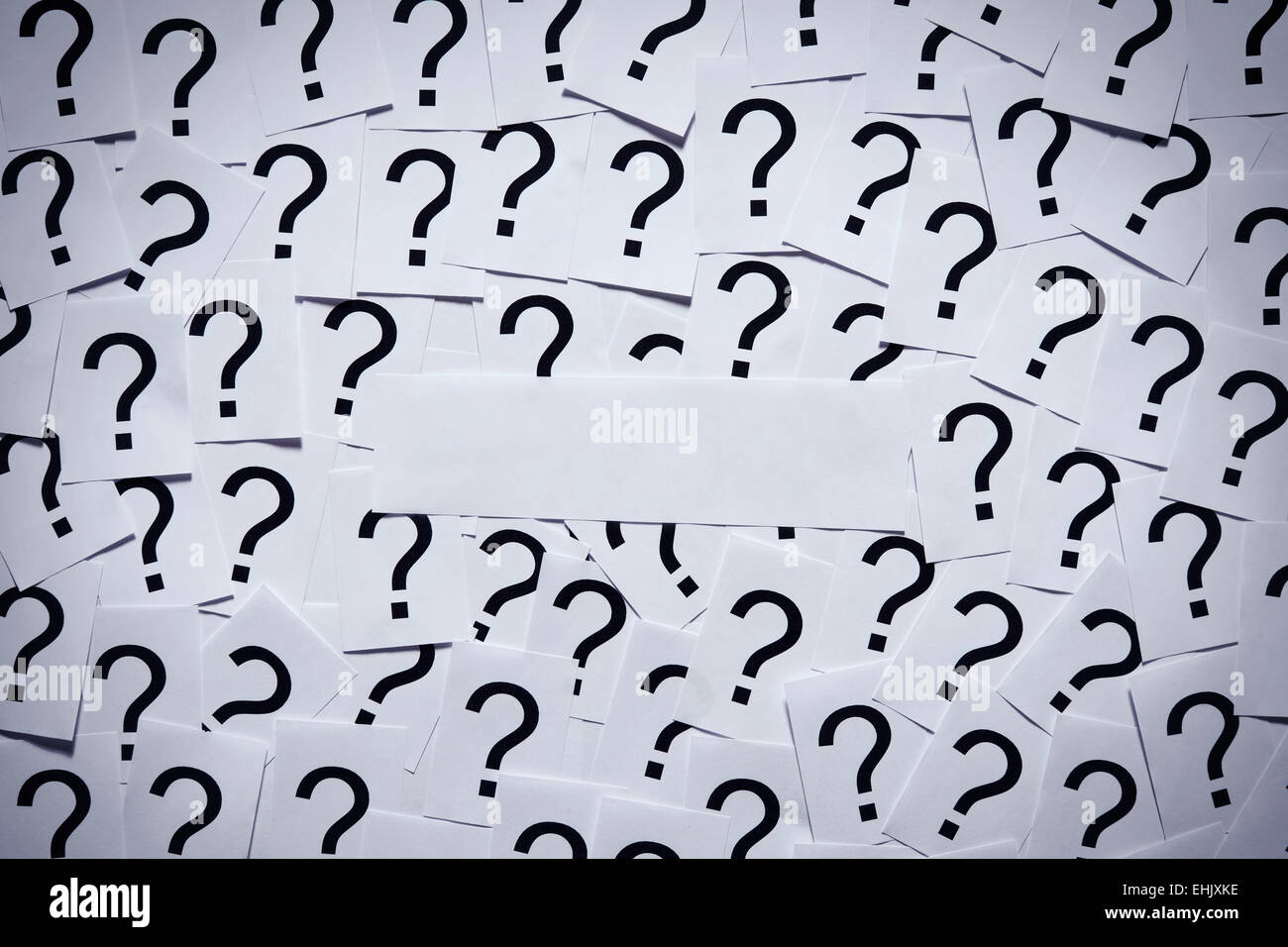 Put your own question on the label. Many question marks on paper ...