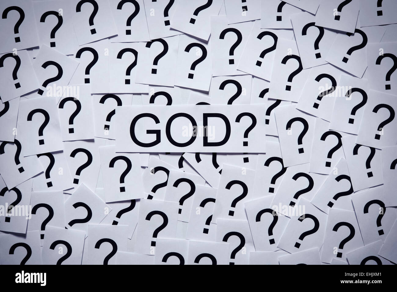 Where is God? Belief? Many question marks on paper. Question concept ...