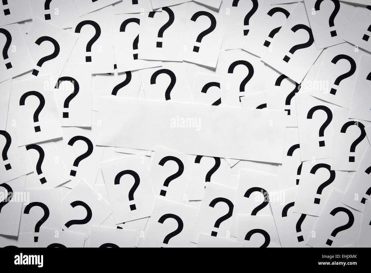 Put your own question on the label. Many question marks on paper ...