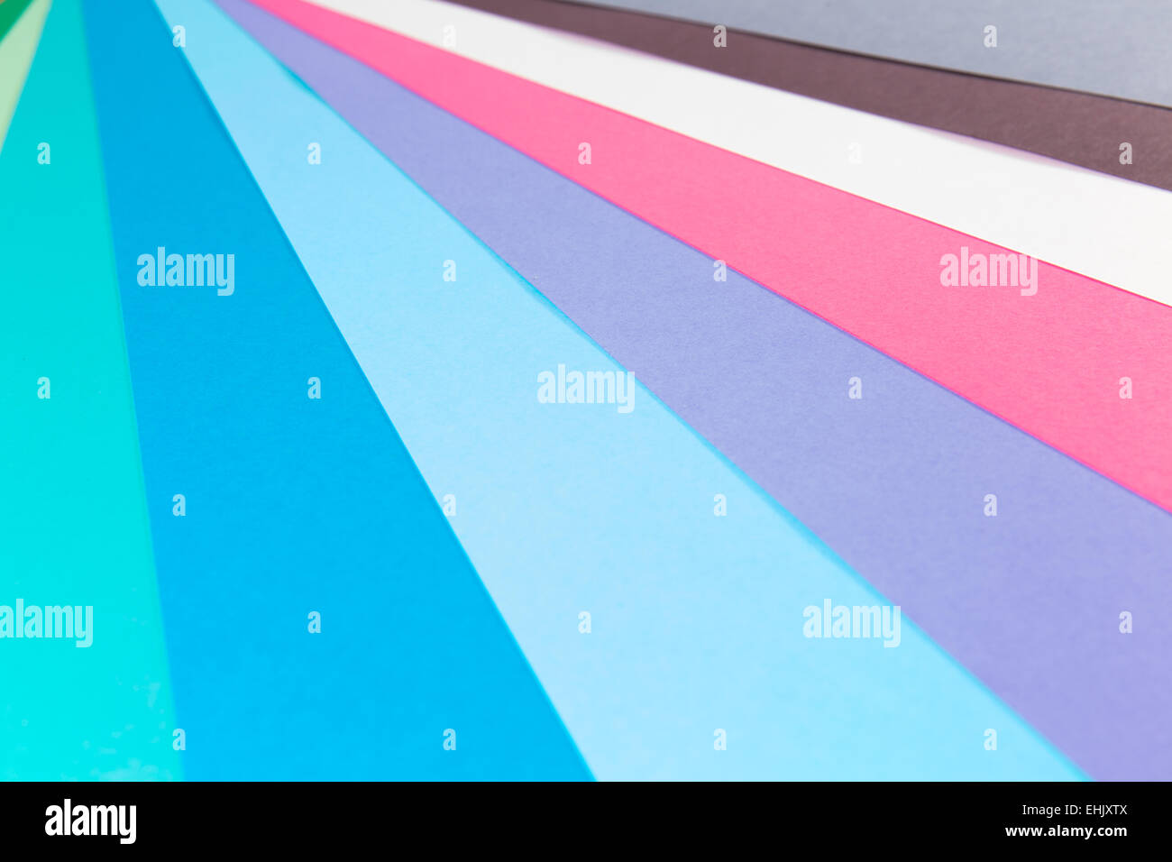 Pastel and vibrant colored paper in a pattern Stock Photo - Alamy