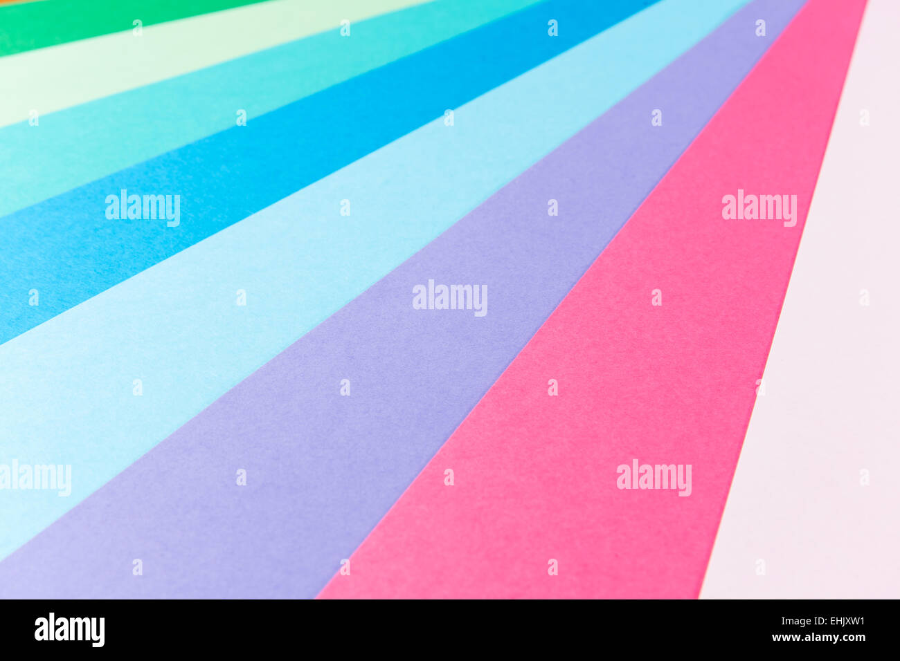 Pastel and vibrant colored paper in a pattern Stock Photo - Alamy