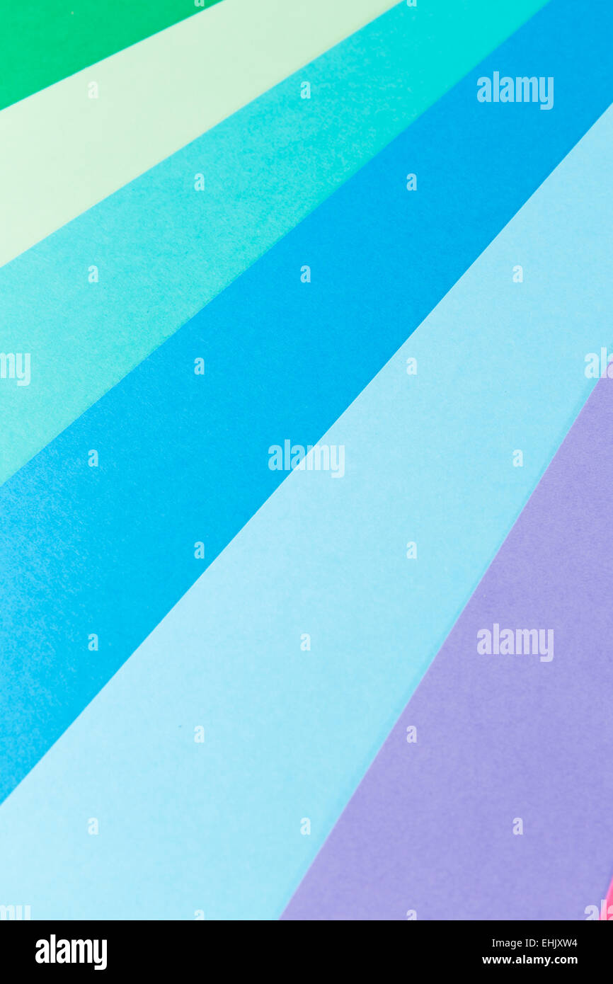 Pastel and vibrant colored paper in a pattern Stock Photo - Alamy