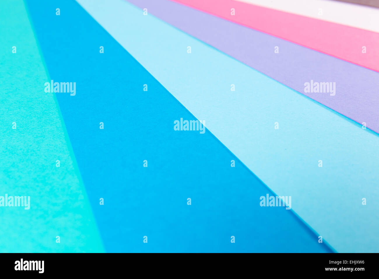 Pastel and vibrant colored paper in a pattern Stock Photo - Alamy