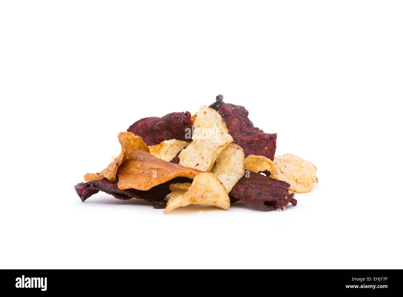 Side view of organic Root Vegetable Chips on white background Stock ...