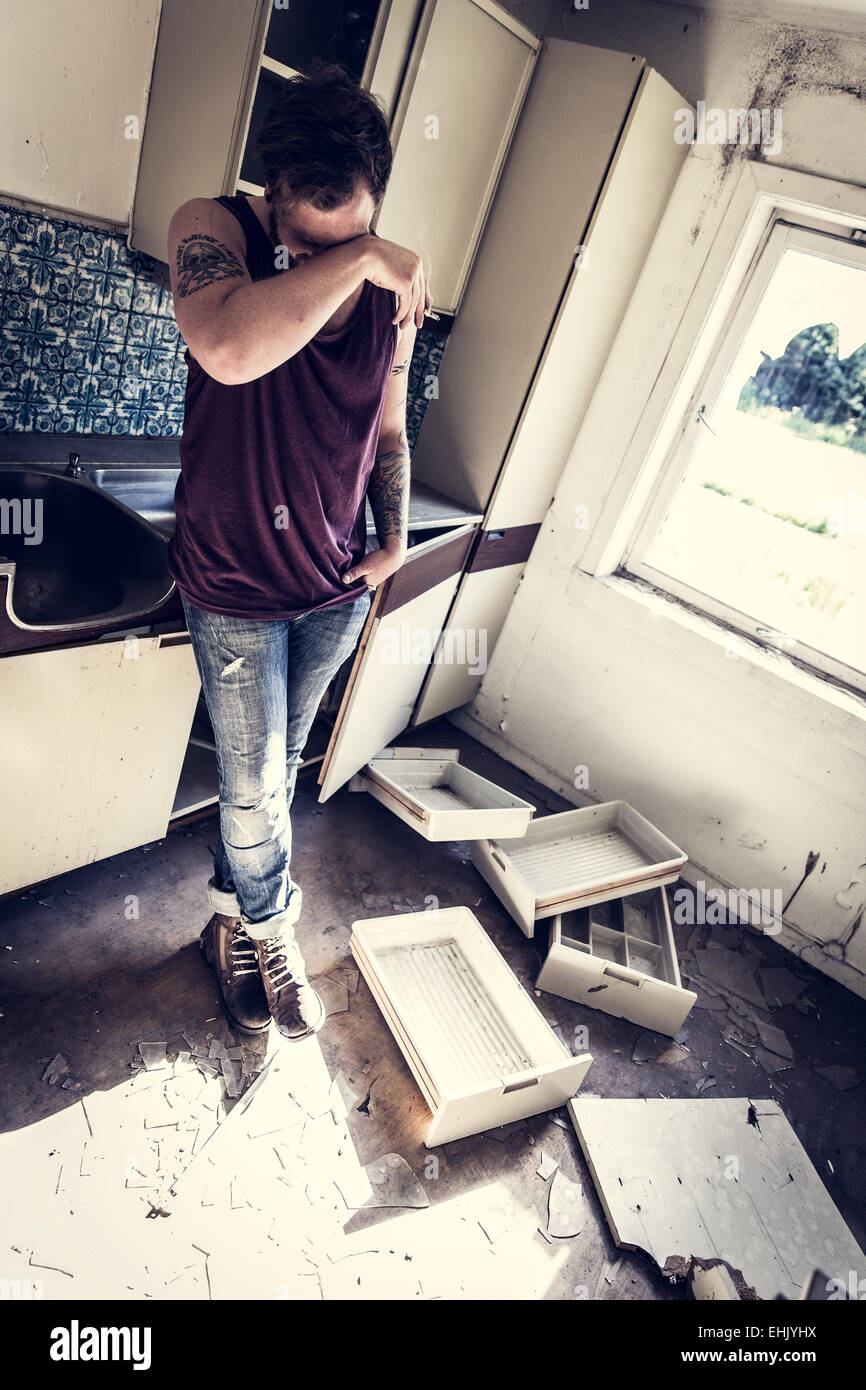 A young and exhausted redneck / rocker with hangover Stock Photo - Alamy