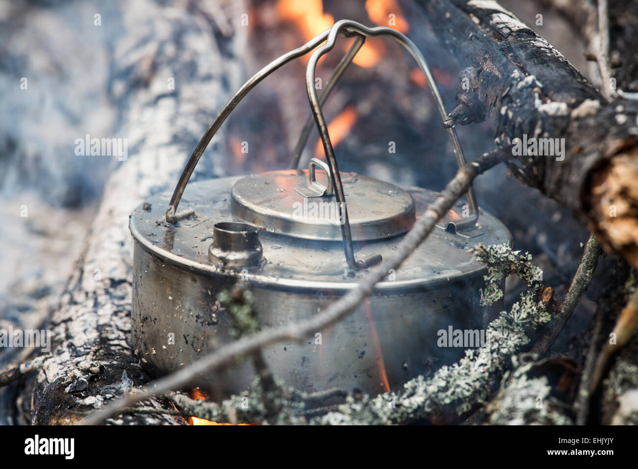Coffee pot in camp fire. Making coffee outside Stock Photo - Alamy