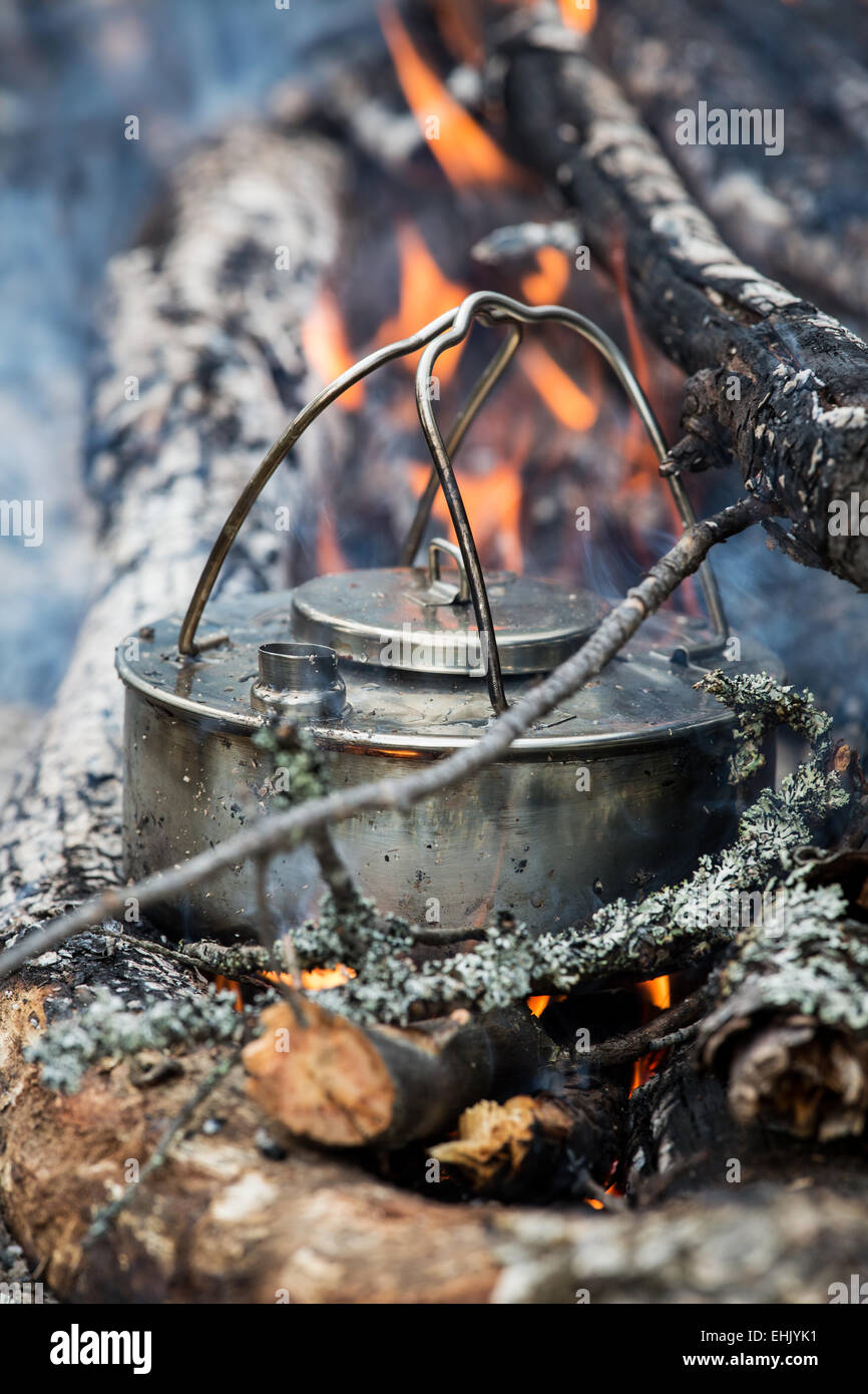 Coffee pot in camp fire. Making coffee outside Stock Photo - Alamy
