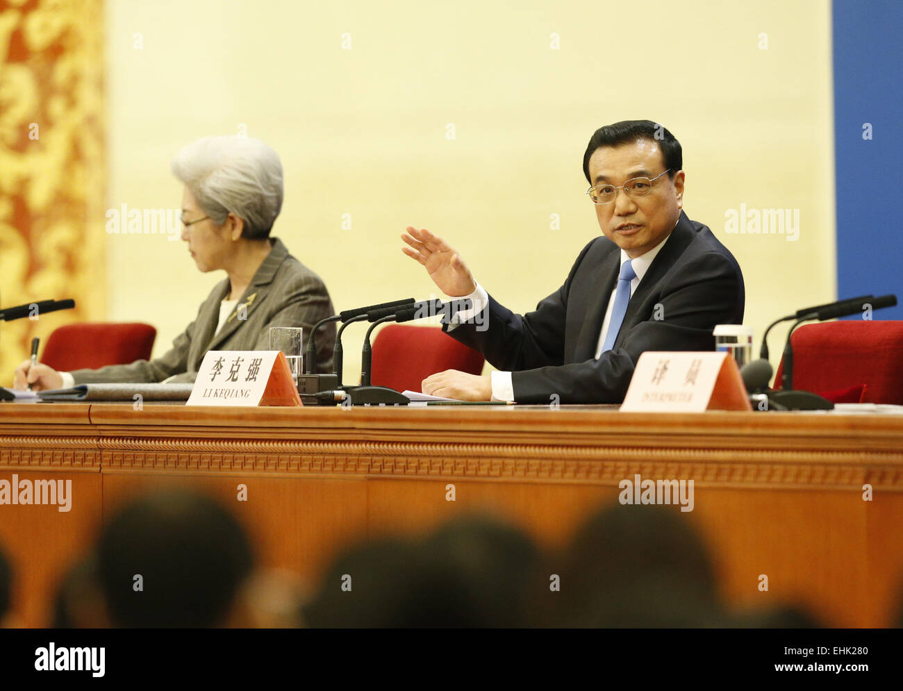 Beijing, China. 15th Mar, 2015. Chinese Premier Li Keqiang (R) speaks ...