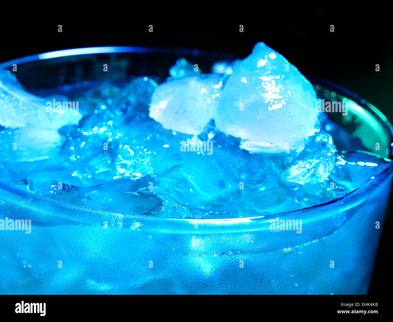 Blue cold cocktail on dark background Stock Photo - Alamy