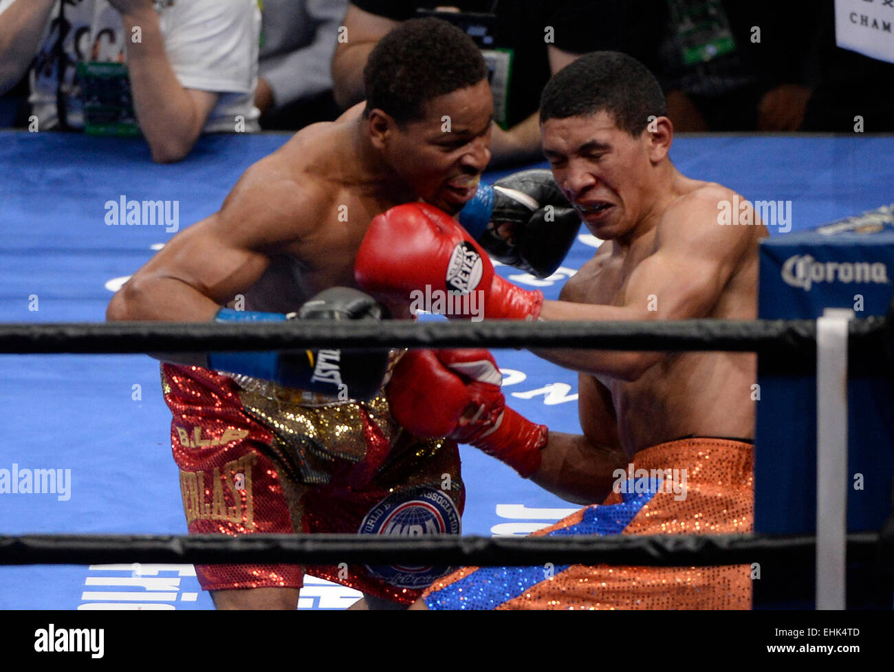 Ontario CA. 13th Mar, 2015. (in gold-red tks) Shawn Porter goes 5 ...