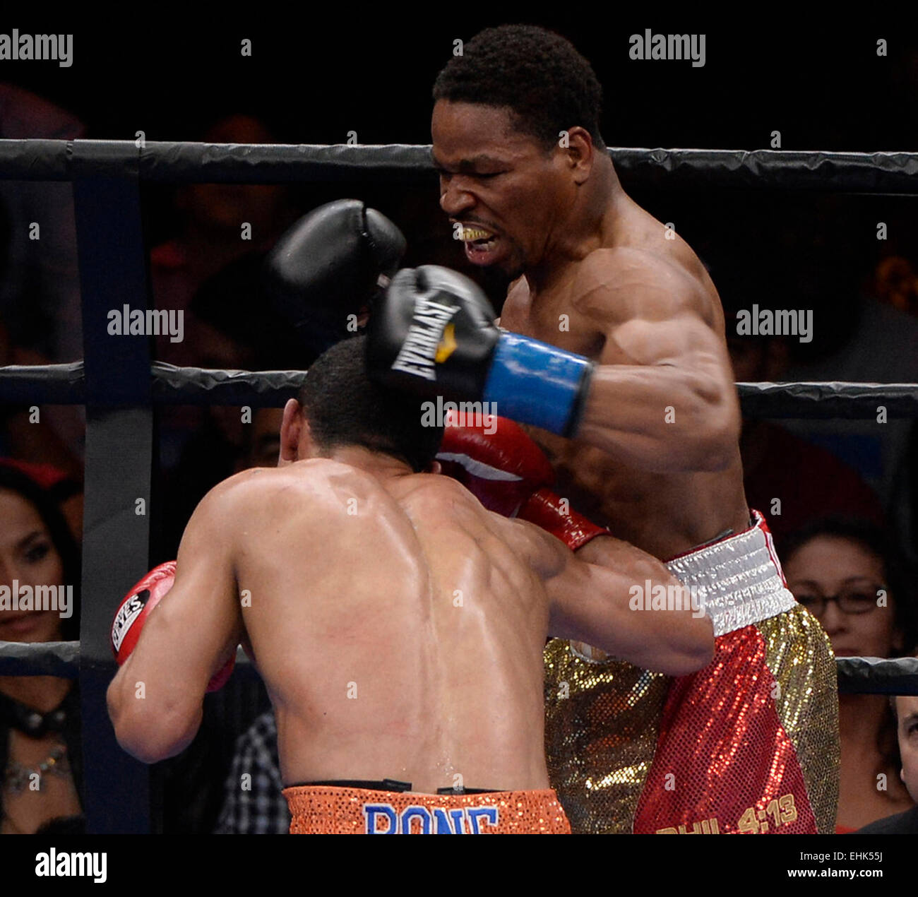 Ontario CA. 13th Mar, 2015. (in gold-red tks) Shawn Porter goes 5 ...