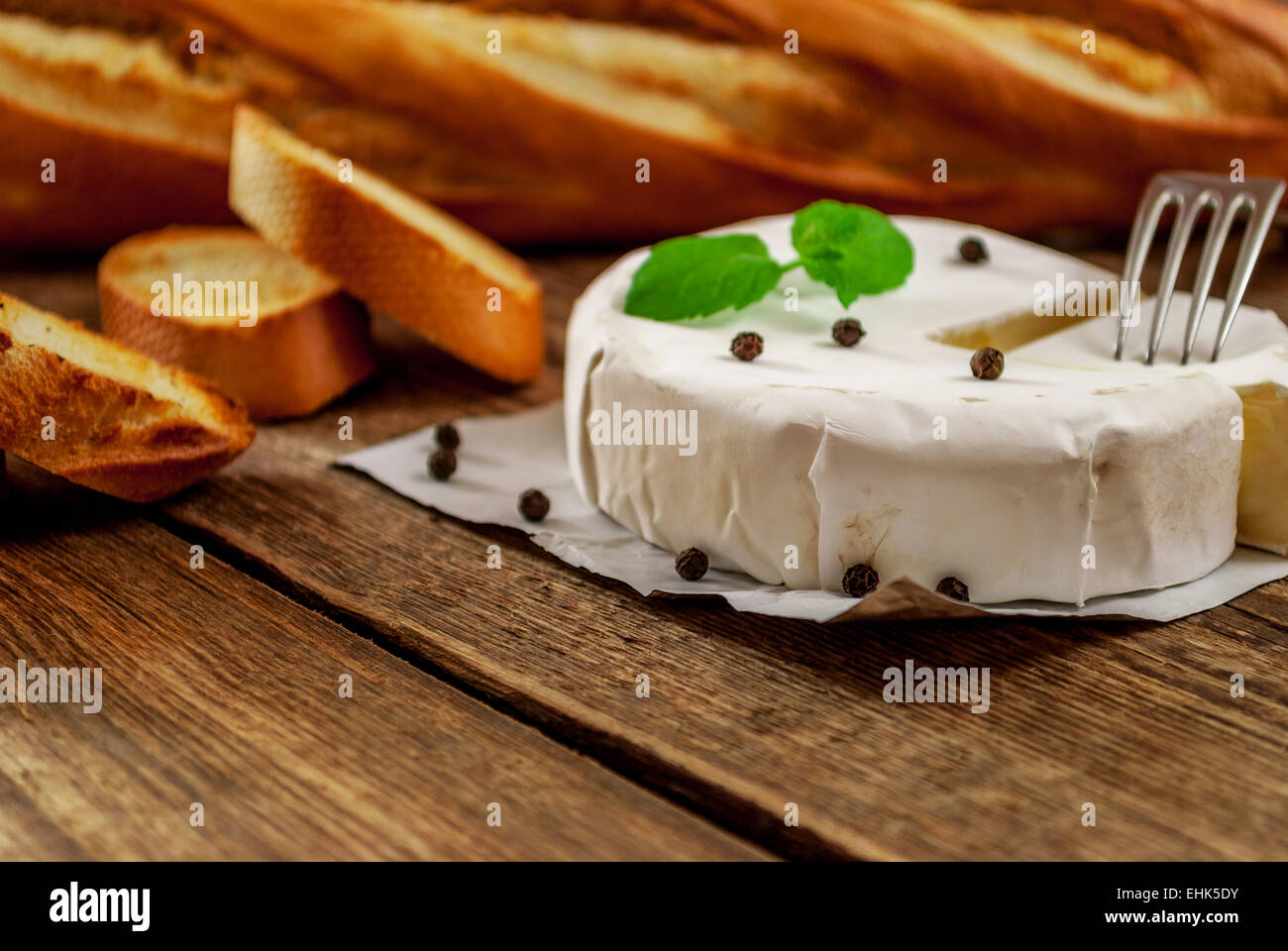 French traditional camembert cheese with baguette on wood table Stock ...