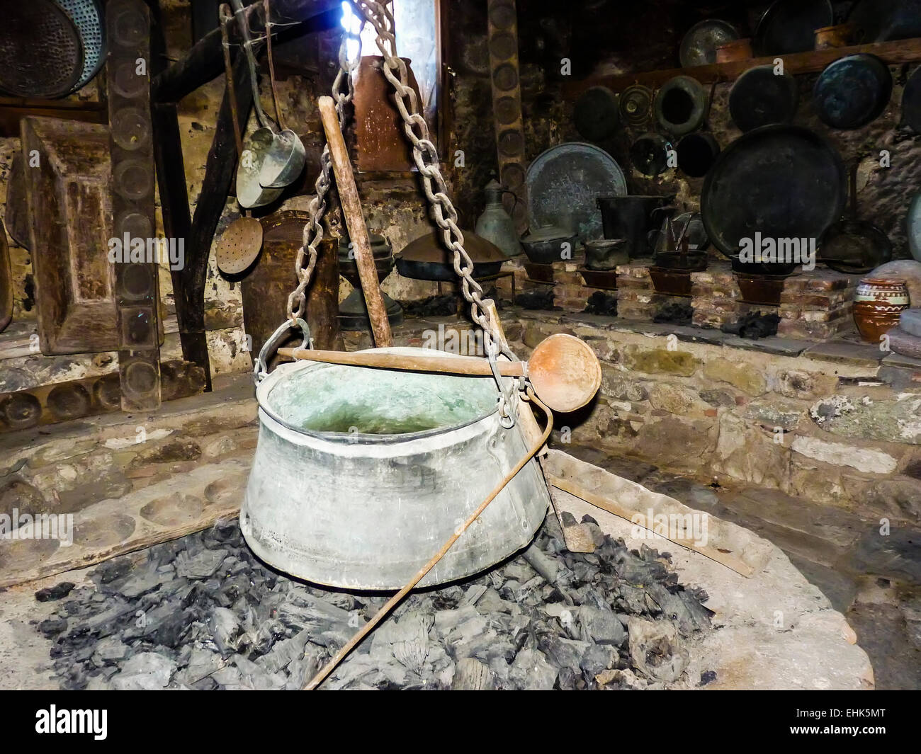 Old Iron Cauldron Pot and Spoon in traditional kitchen Stock Photo - Alamy