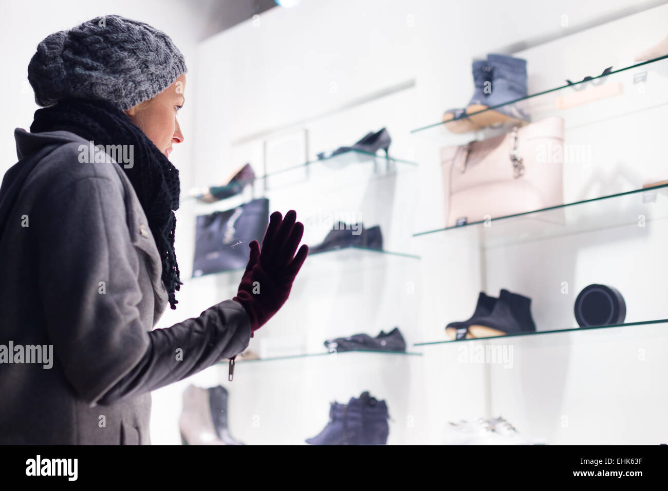 Woman window shopping Stock Photo - Alamy