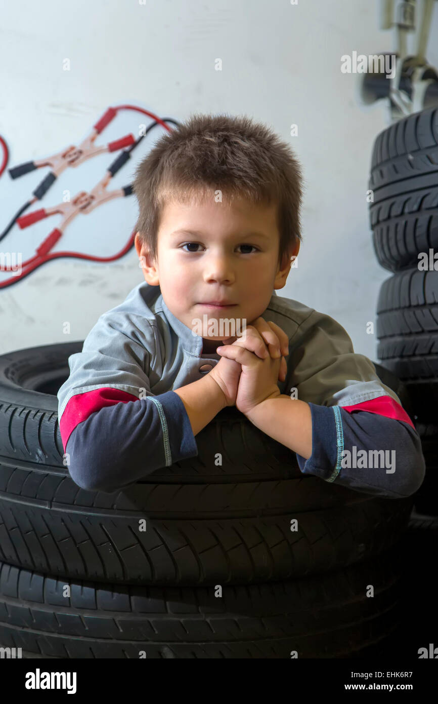 Boy in the auto repair shop Stock Photo - Alamy