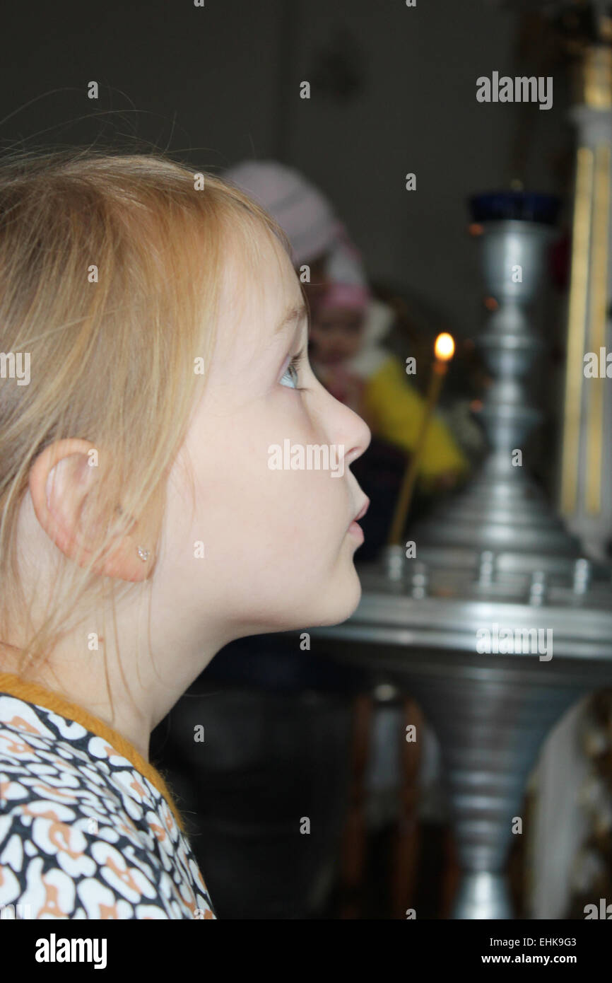 Little pretty girl praying in the church Stock Photo - Alamy
