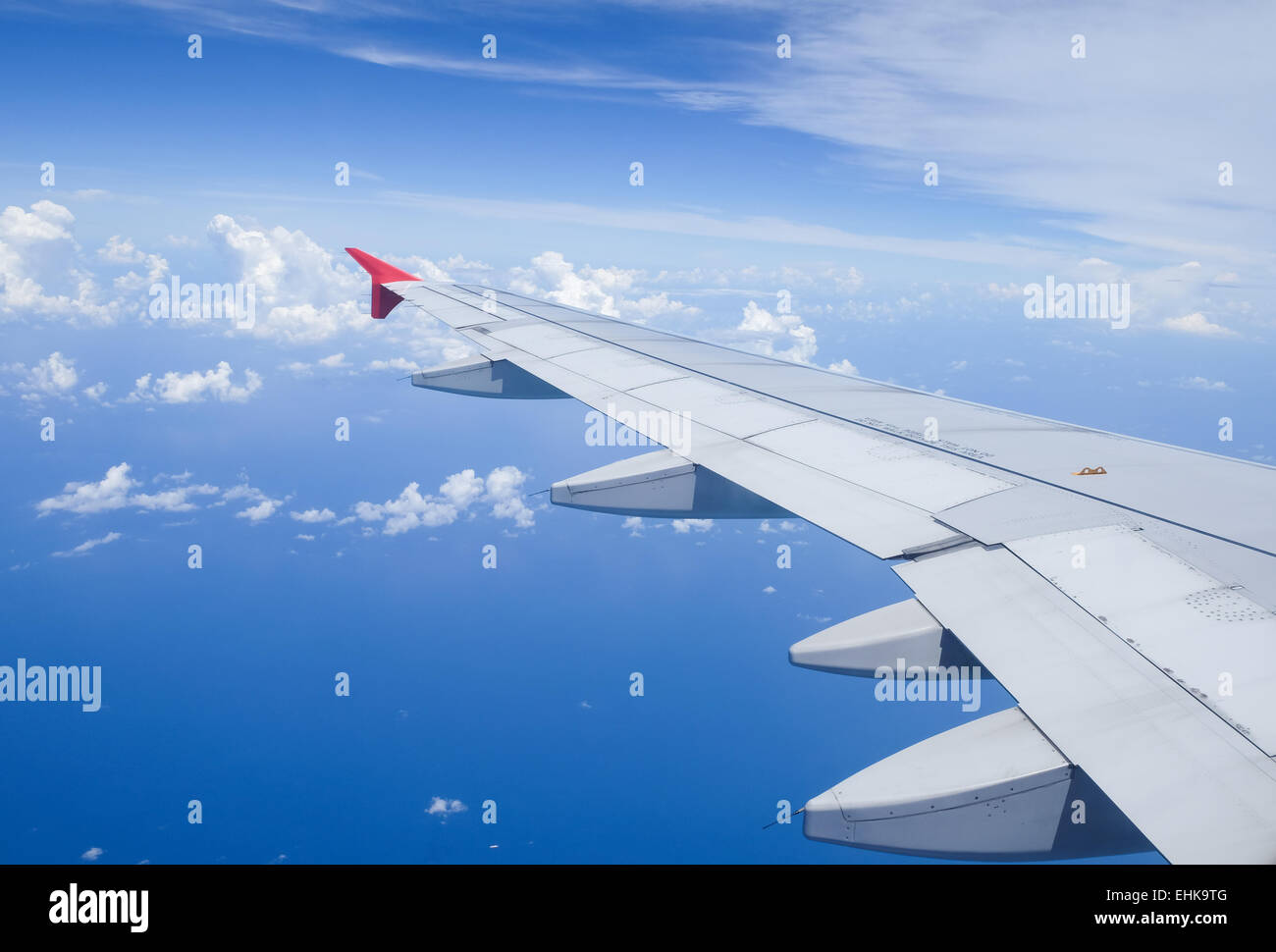 Airplane wing over blue sky hi-res stock photography and images - Alamy