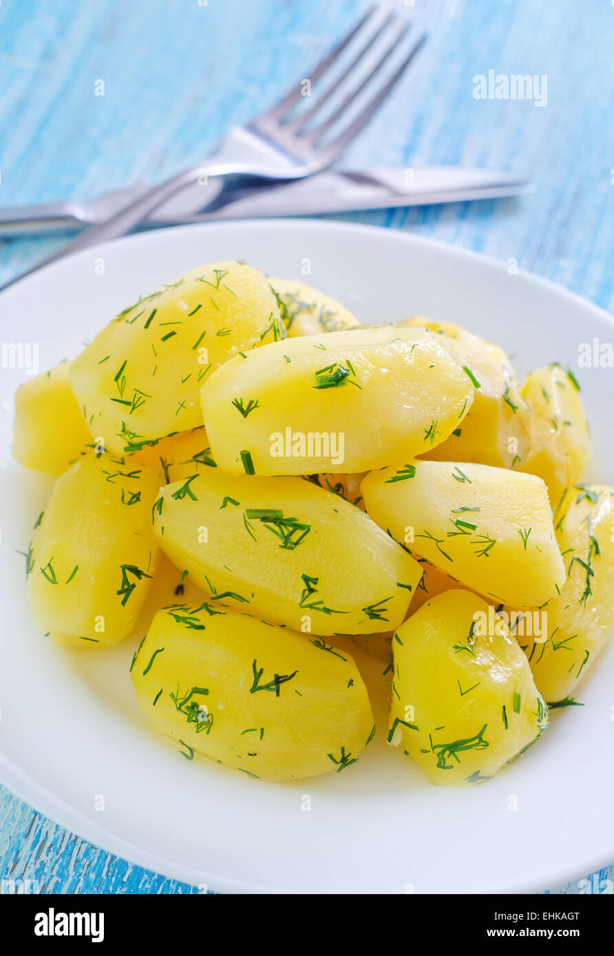 boiled potato on plate and on a table Stock Photo - Alamy