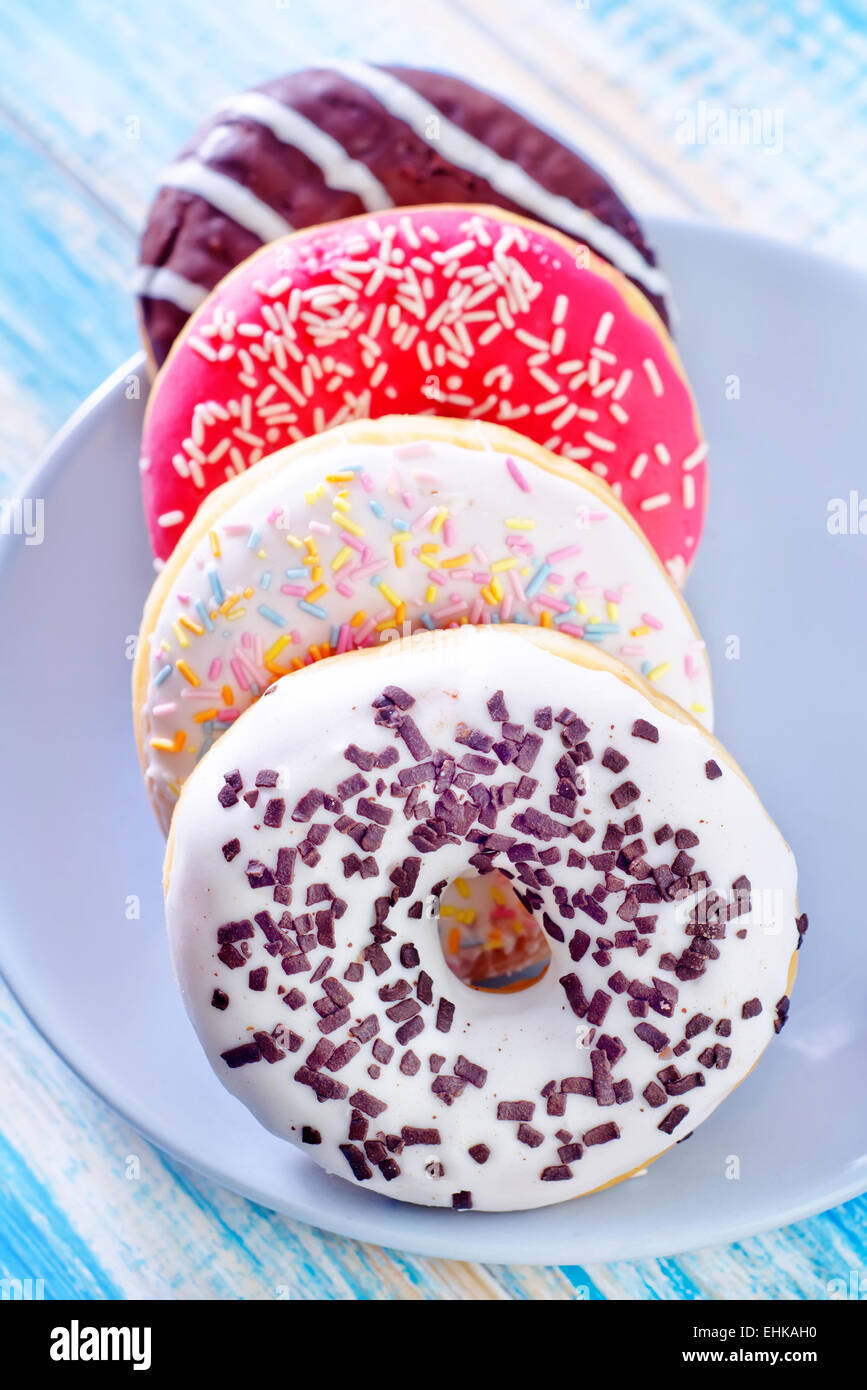 donuts on plate and on a table Stock Photo - Alamy
