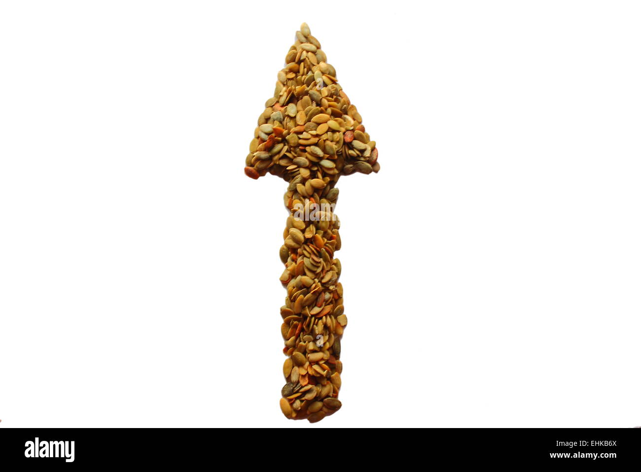 pumpkin seed laid pointer up on white background Stock Photo - Alamy