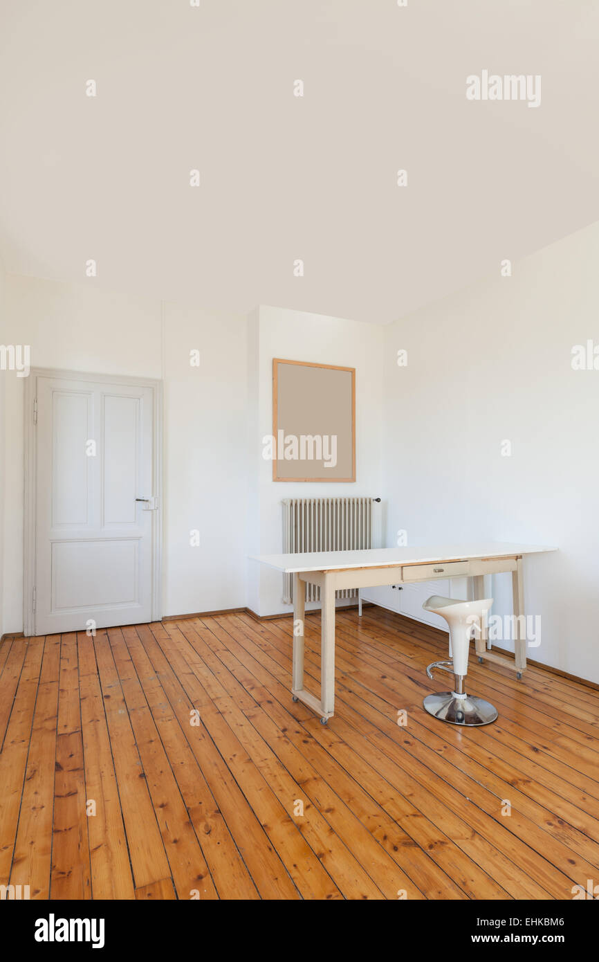home interior, view table in a room with white walls Stock Photo - Alamy