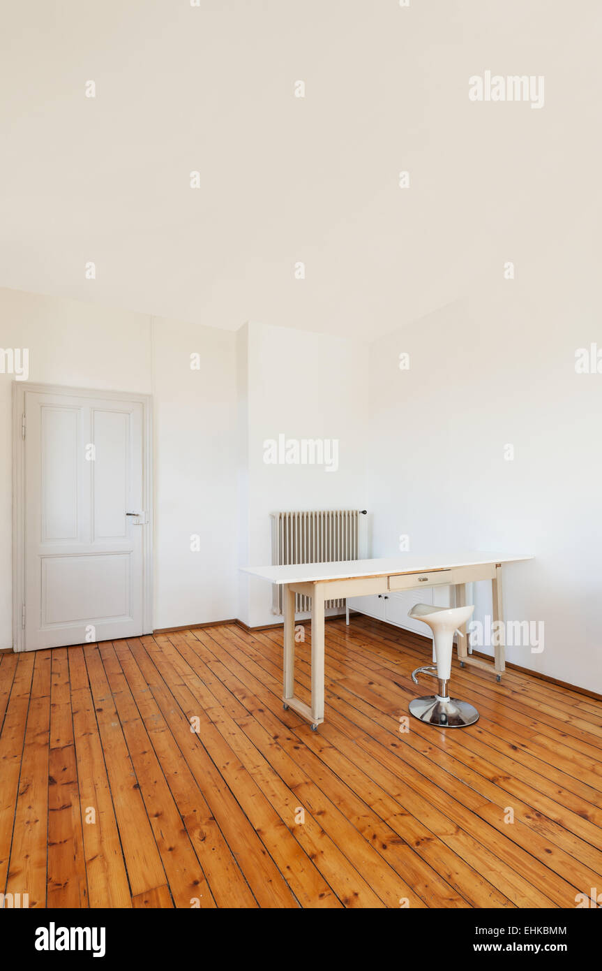 home interior, view table in a room with white walls Stock Photo - Alamy
