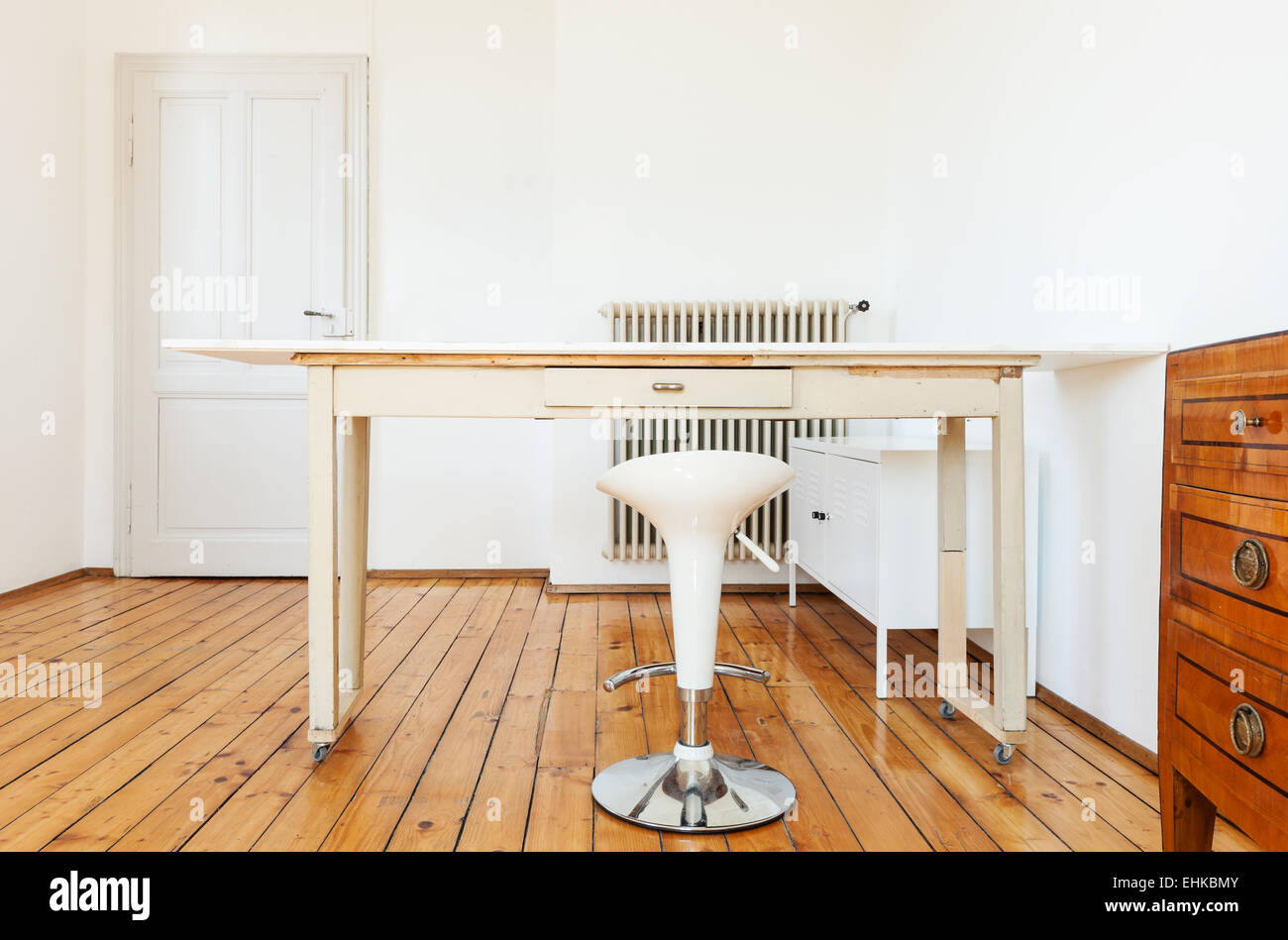 home interior, view table in a room with white walls Stock Photo - Alamy