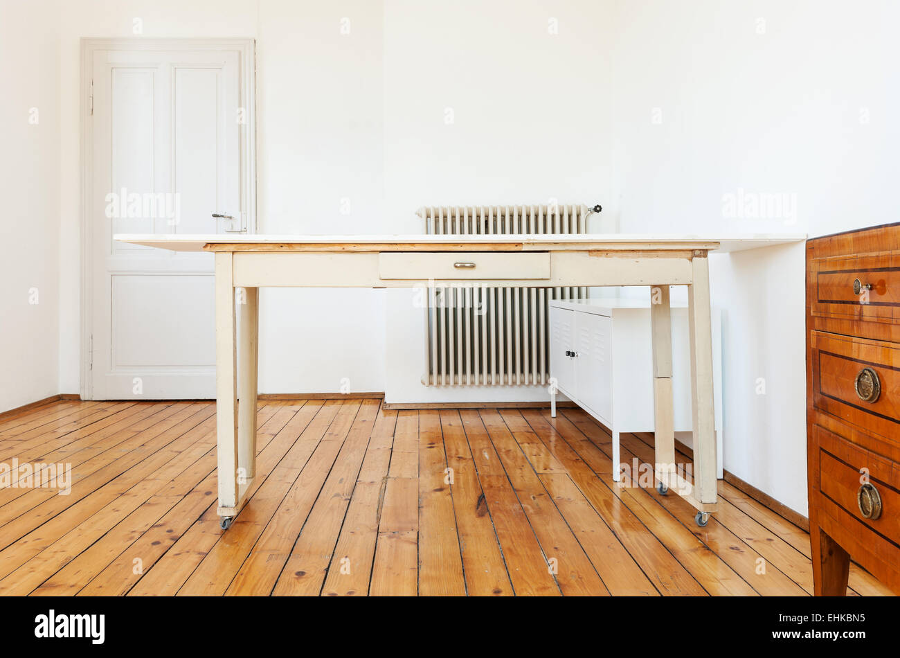 home interior, view table in a room with white walls Stock Photo - Alamy